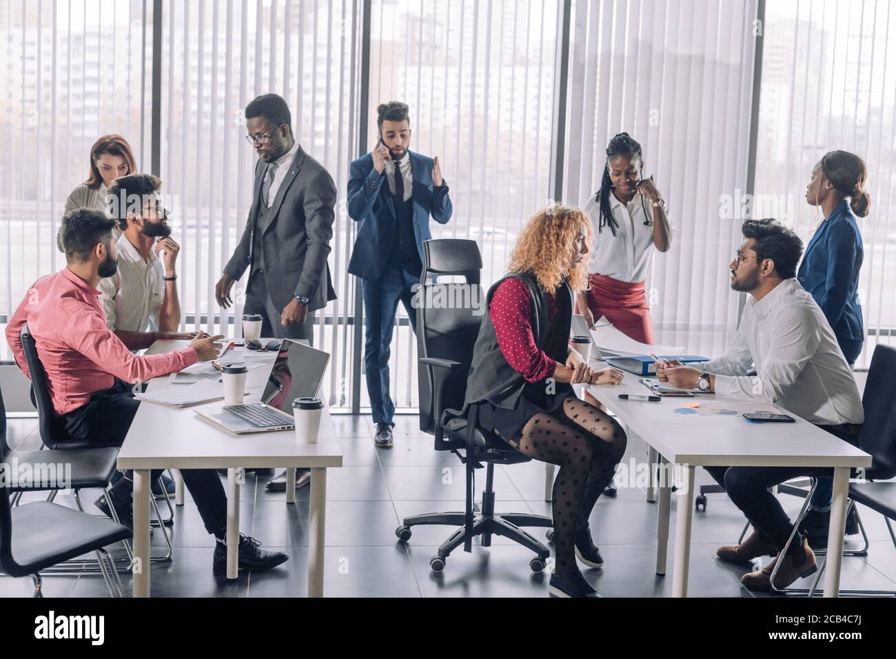 Relaxed informal IT business company meeting. Team leader in formal ...