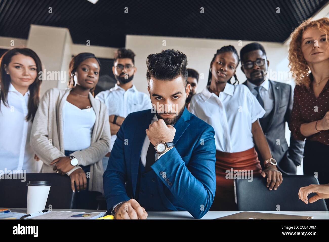 serious effective experienced boss with his colleagues. leader ...