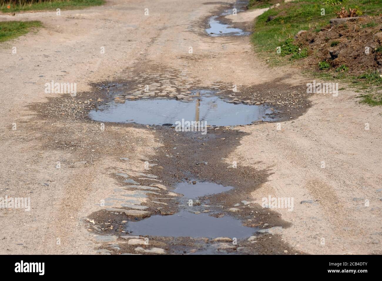 Deep puddle on a dirty road hi-res stock photography and images - Alamy