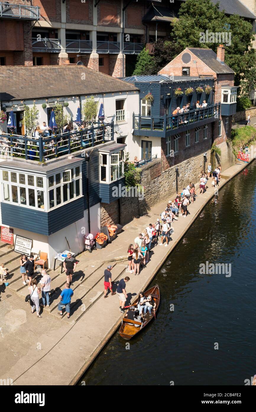 People queuing to hire Browns rowing boats on the river in Durham City ...