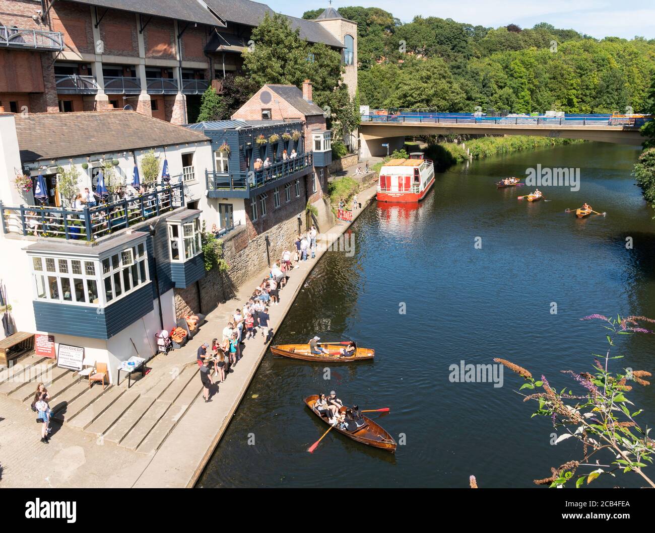 People queuing to hire Browns rowing boats on the river in Durham City ...