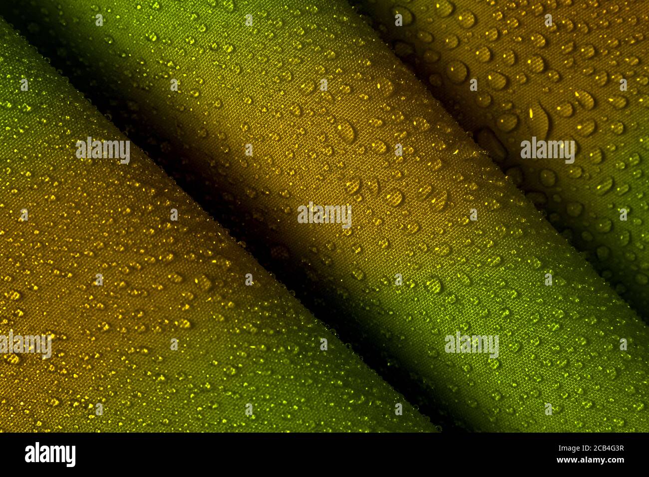Abstract background of hydrophobic fabric. Drops of water on creased ...