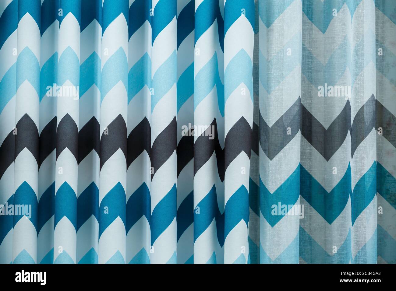 Curtain samples hanging from hangers on rail in store. Fabric texture ...