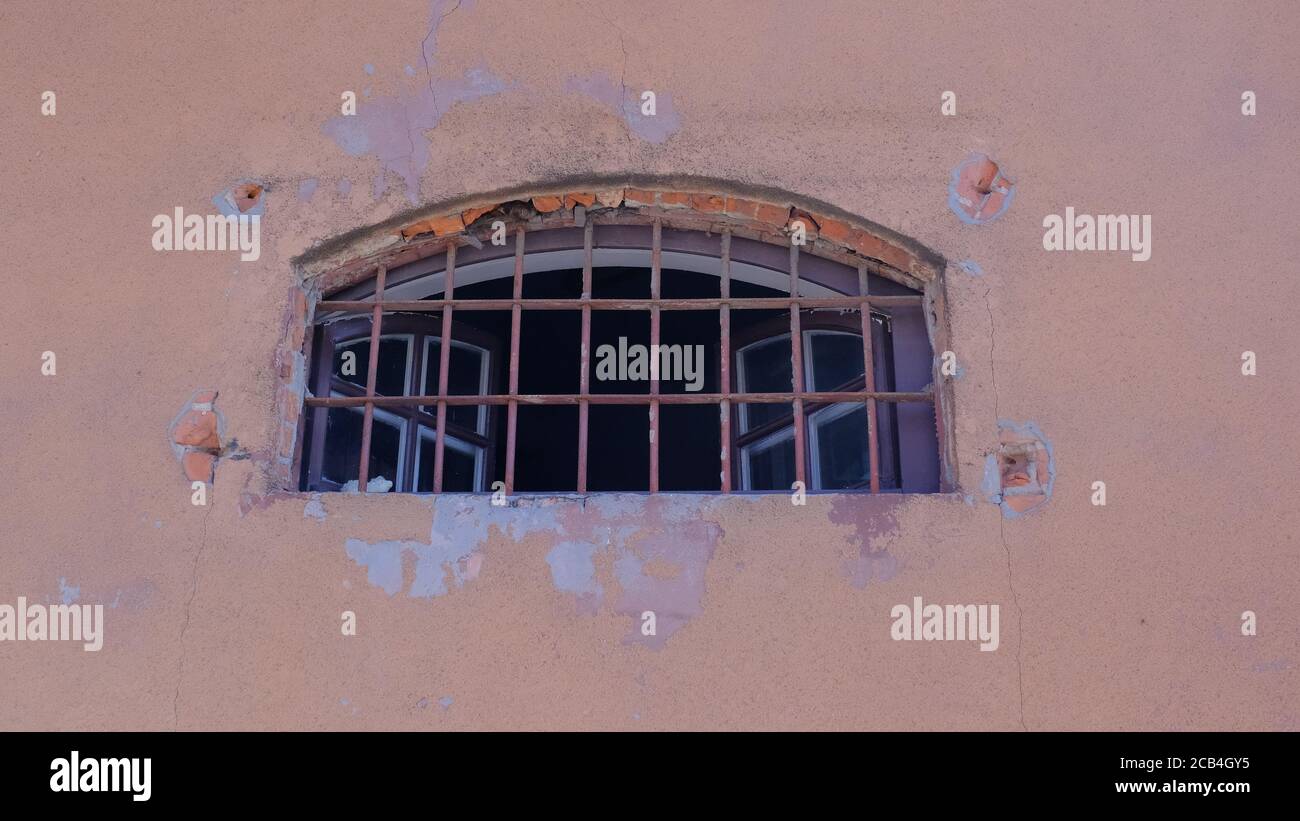 open wide prison window with rusty metal bars. Window in the wall Stock ...