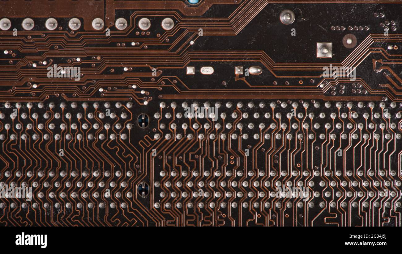 Modern printed brown circuit board, electronic circuit board, textolite ...