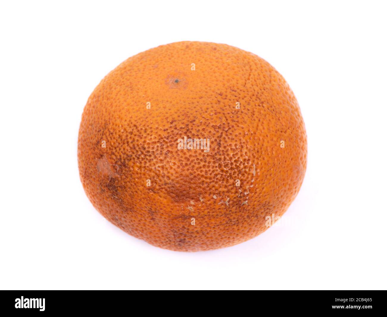Almost rotten orange isolated on white background Stock Photo - Alamy