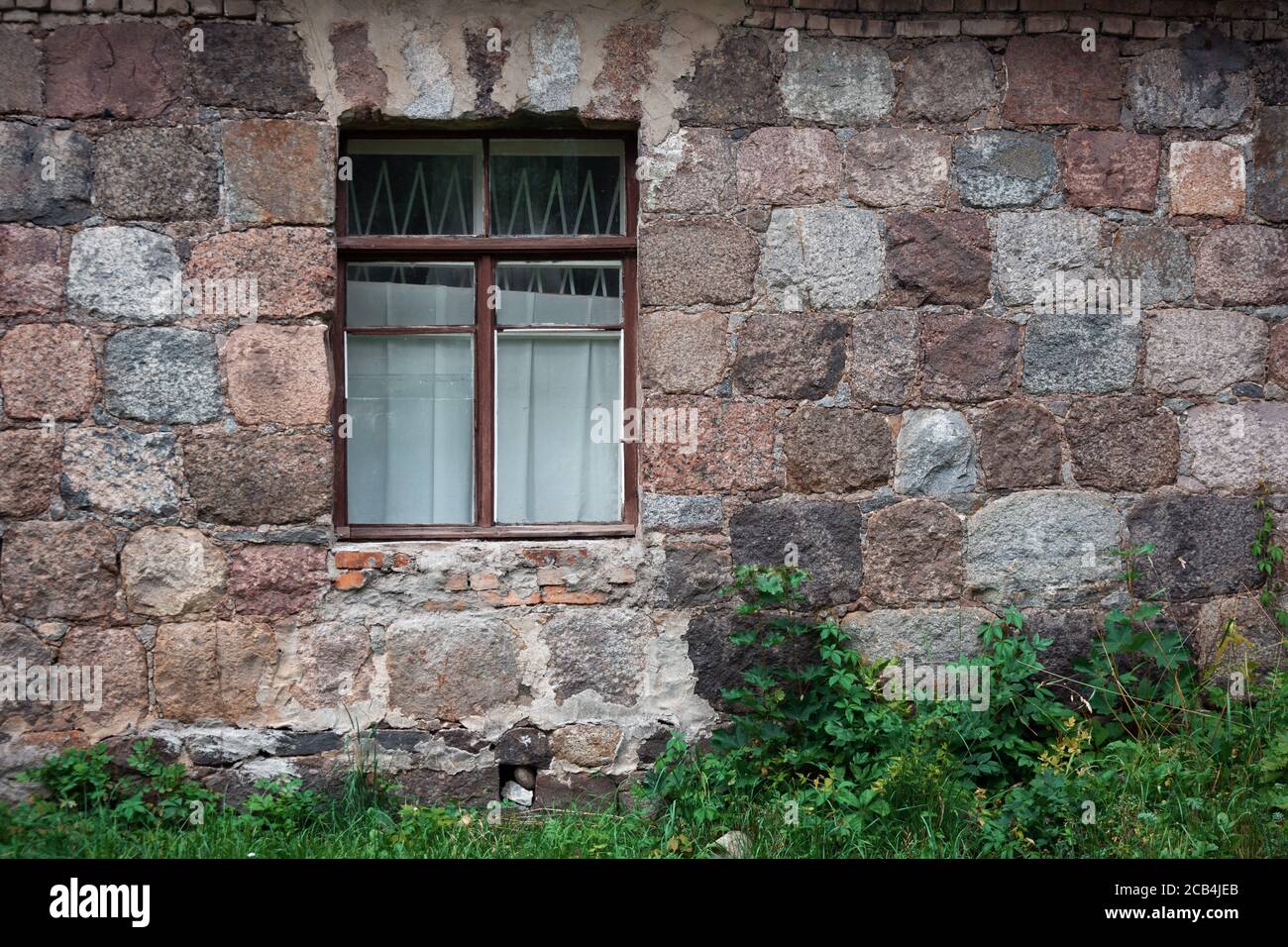Window in old stone wall Stock Photo - Alamy