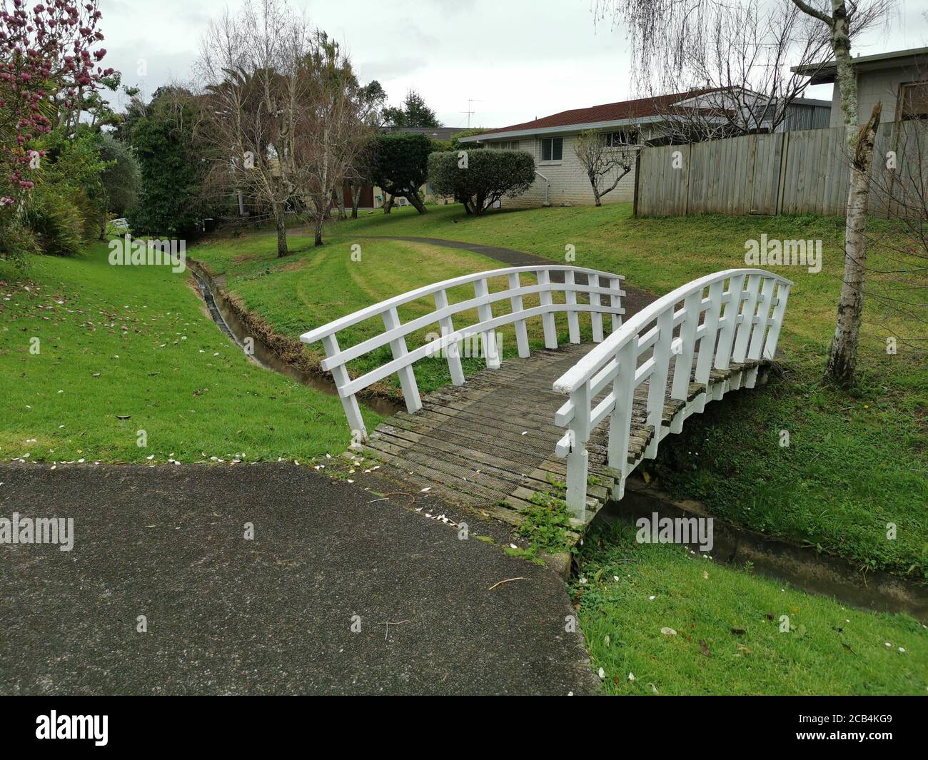 Small pond and decorative white wooden bridge in park Stock Photo - Alamy