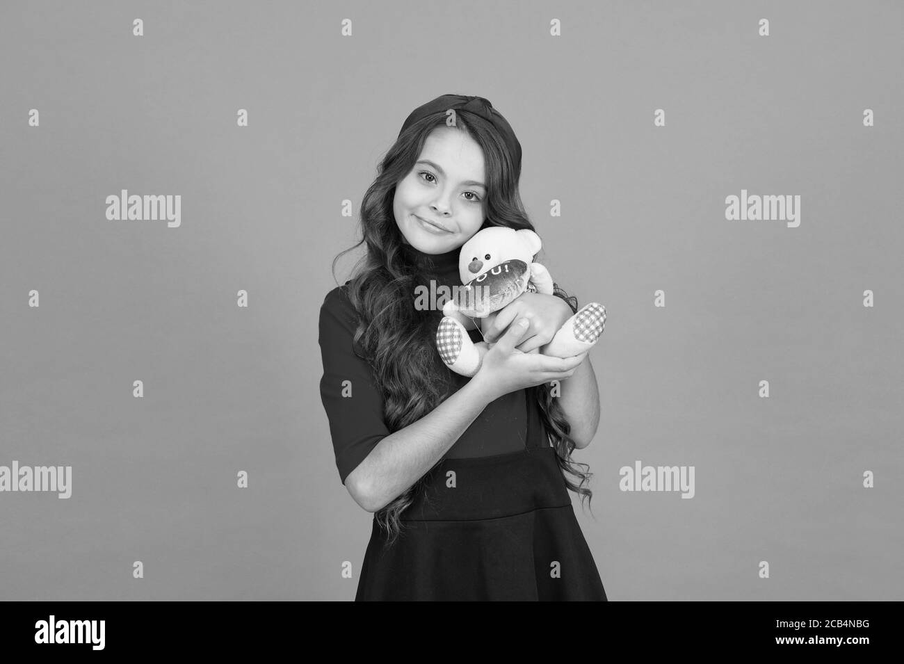 Cuddly toy is my only joy. Happy child cuddle soft toy. Little girl ...