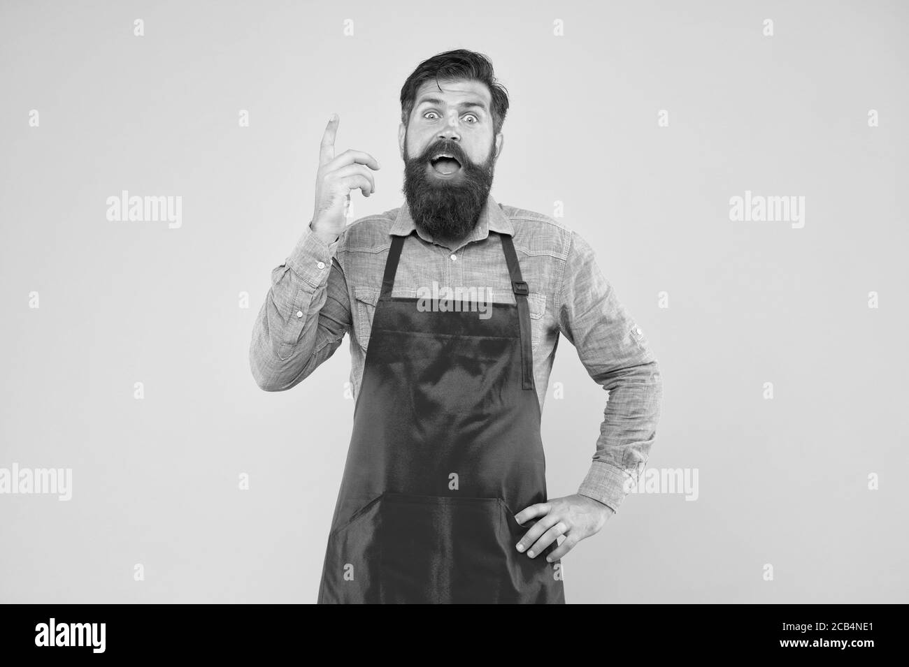How to cook. Barber man in an apron got an idea. handsome confident guy ...
