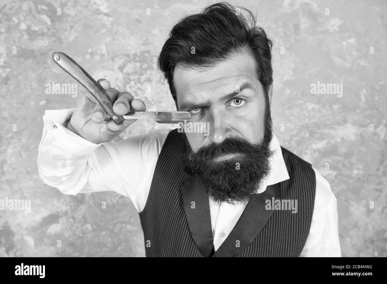 Cool and trendy. Bearded man hold retro razor. Shaving razor kit for ...