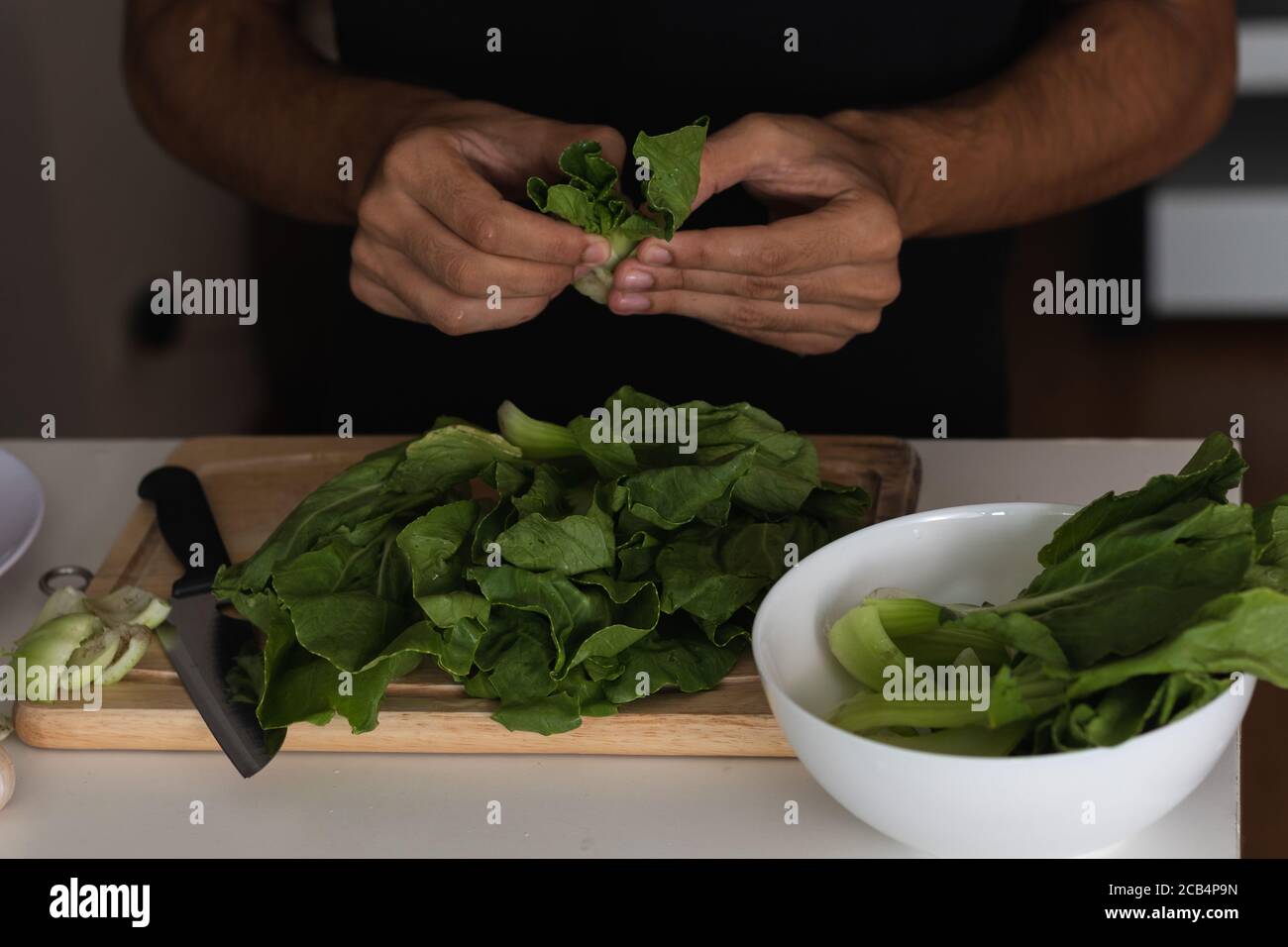 Man chef cutting greenery hi-res stock photography and images - Alamy