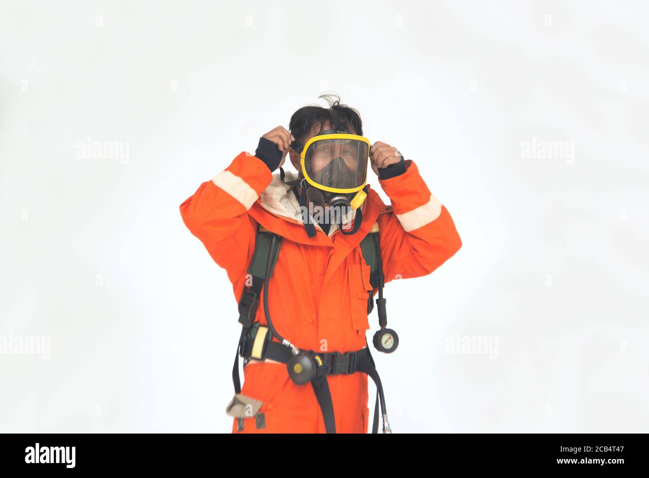 The portrait of Asian firefighters are wearing orange fire protection ...
