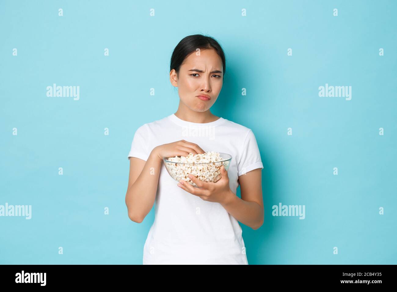 Lifestyle, leisure and emotions concept. Skeptical and displeased asian ...