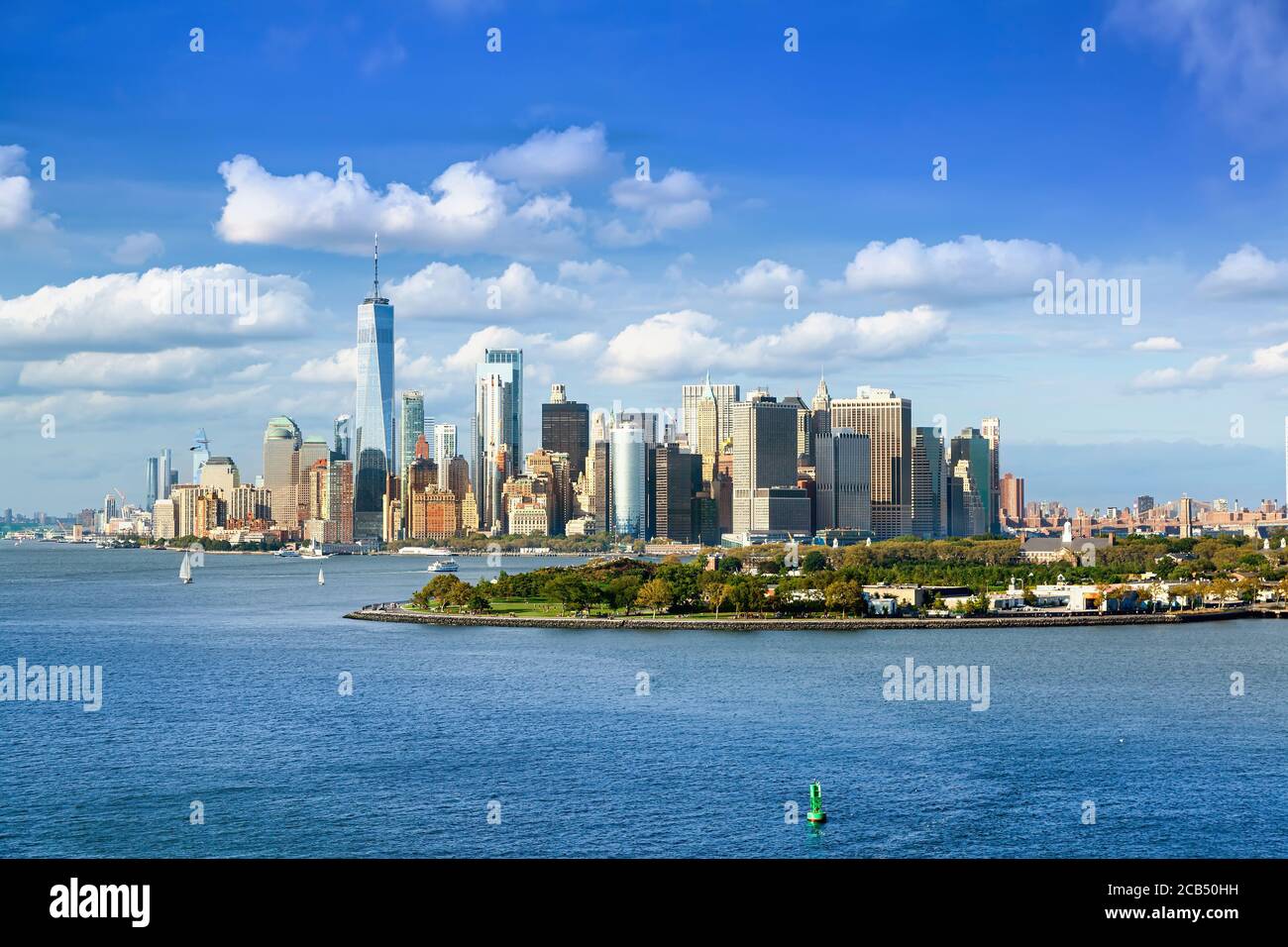 New York City panorama from the bay with Governors island and Manhattan ...