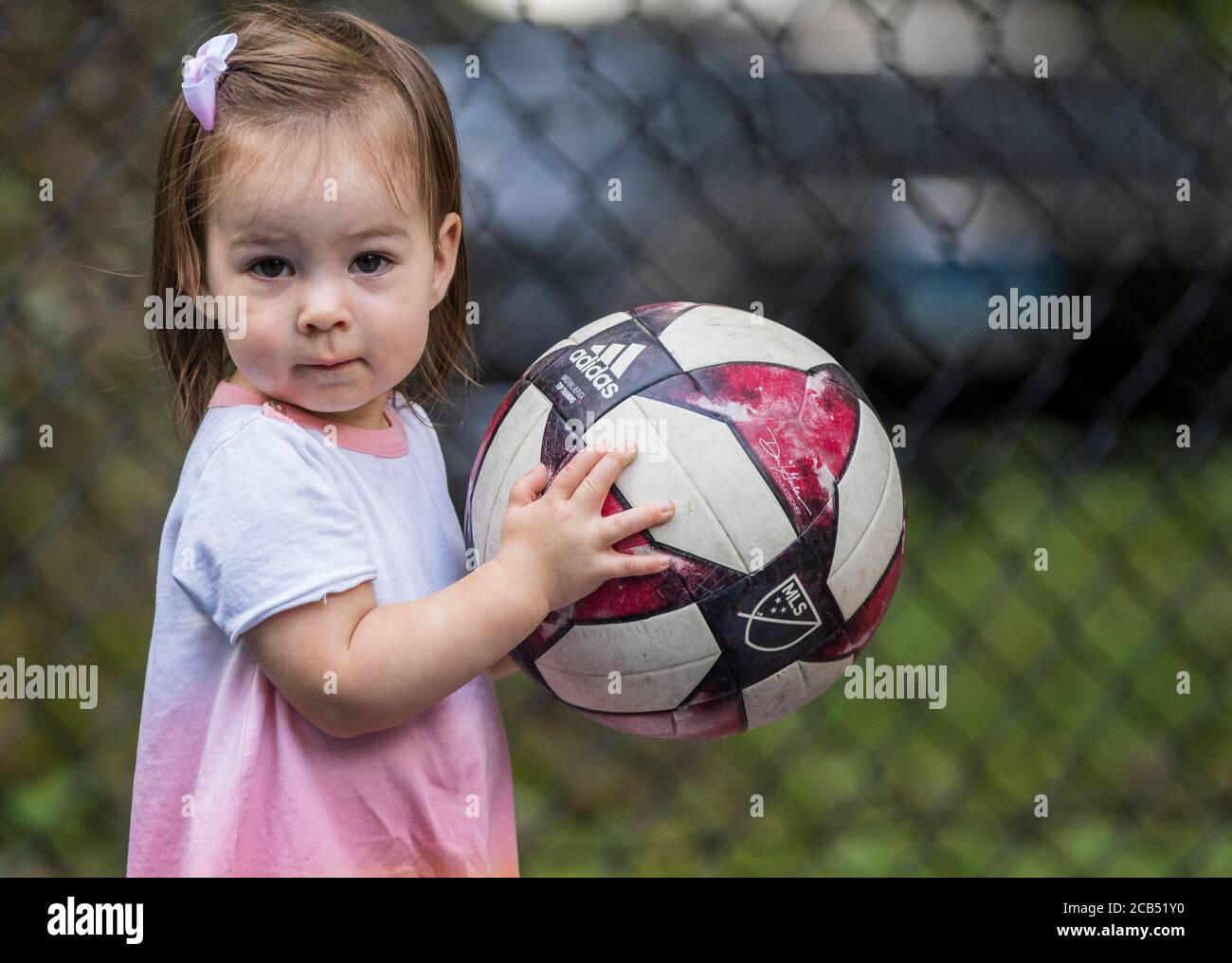 Child plays with a soccer ball Stock Photo - Alamy