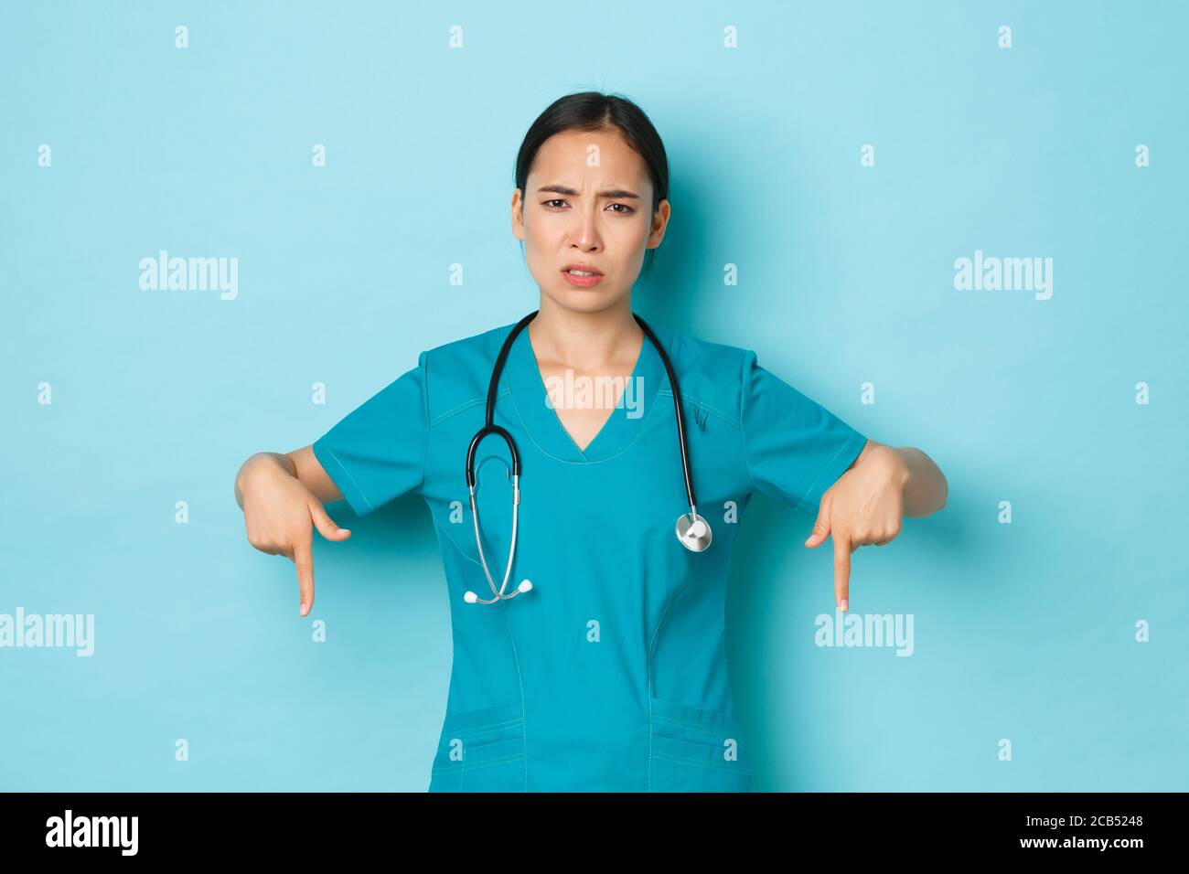 Upset patient pointing at nurse hi-res stock photography and images - Alamy