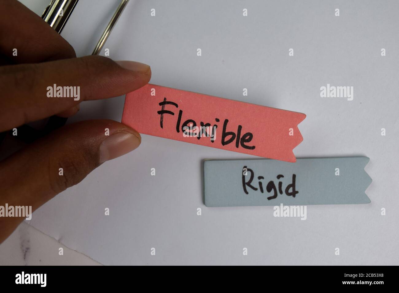 Flexible and Rigid write on sticky notes isolated on office desk Stock ...