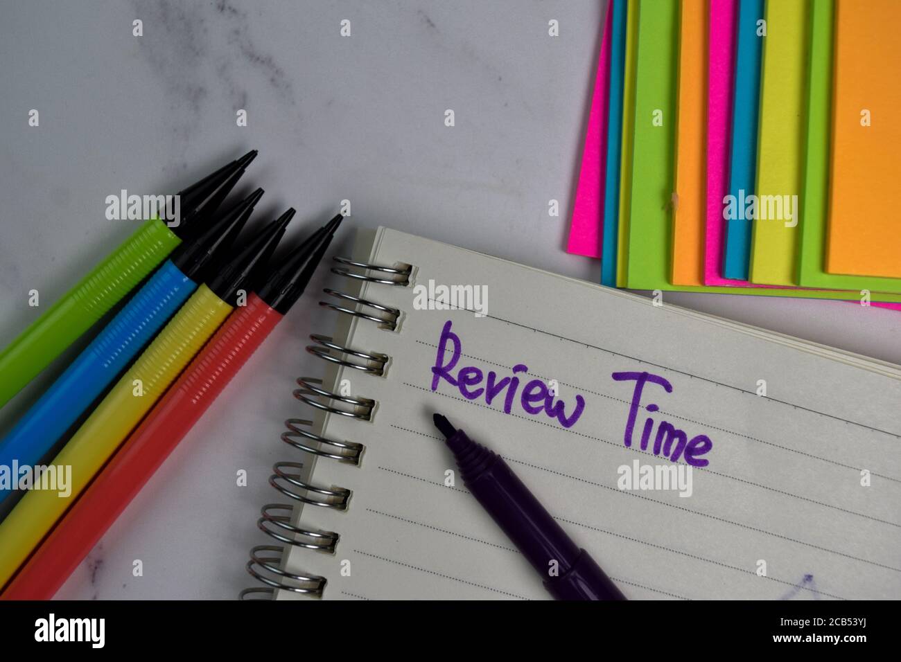 Review Time write on a book isolated on office desk Stock Photo - Alamy