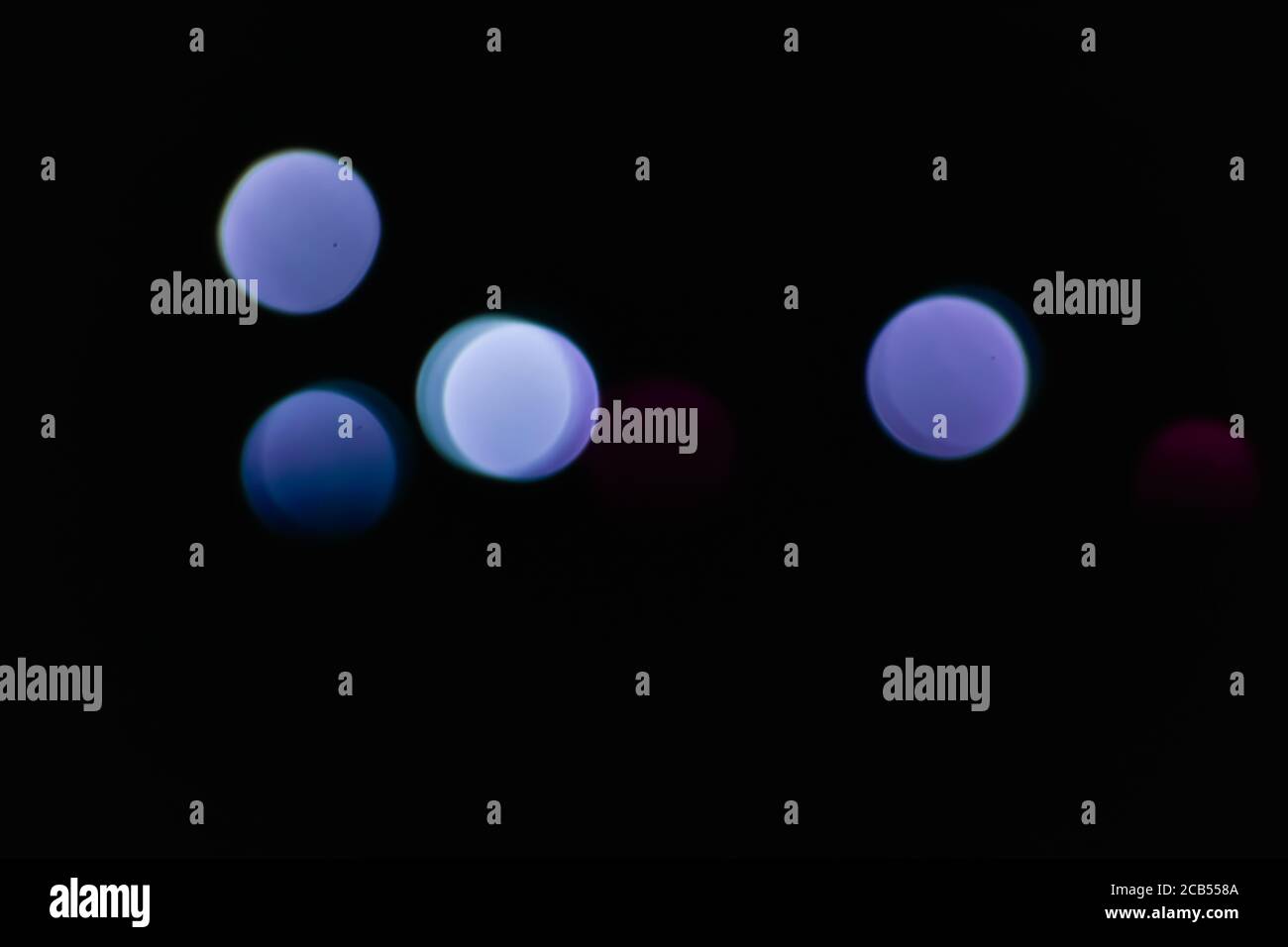 Background image of unfocused lights with black background Stock Photo ...