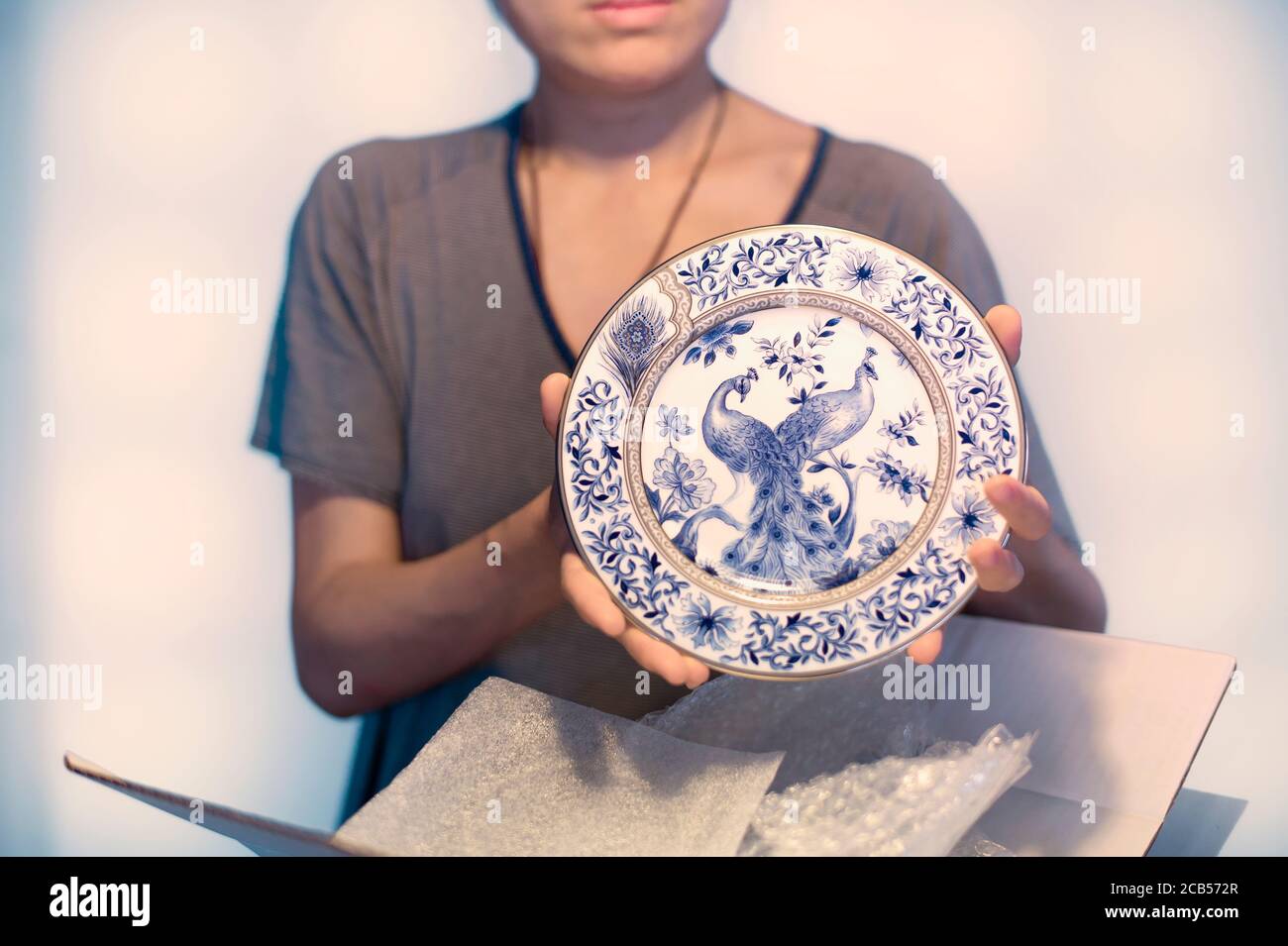 woman holding a plate Stock Photo - Alamy