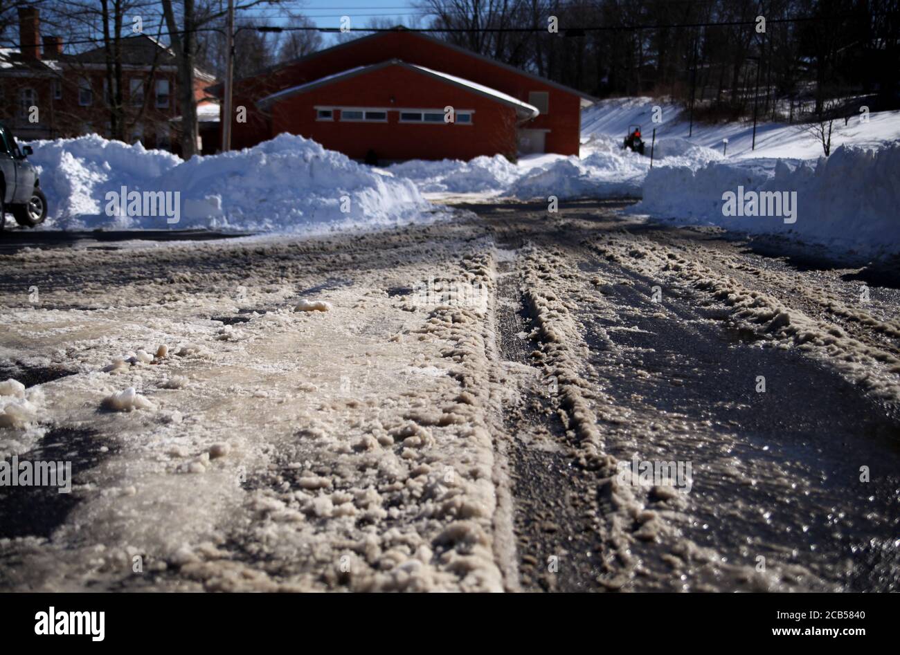 The slush road and snowbanks aside on sunny bright day Stock Photo - Alamy