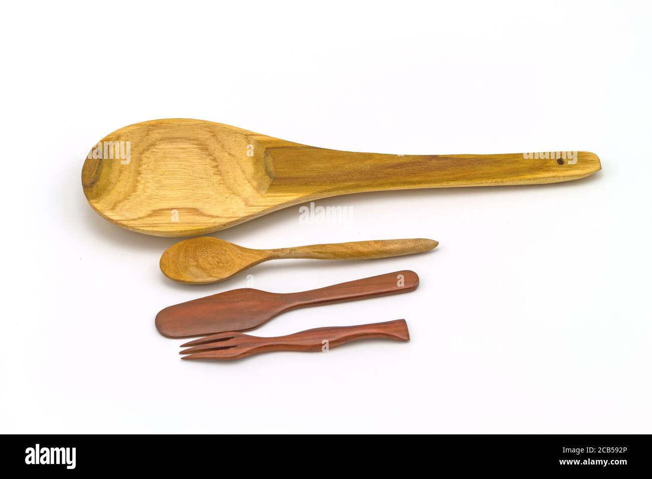 Manny wooden spoon isolated on white background Stock Photo - Alamy