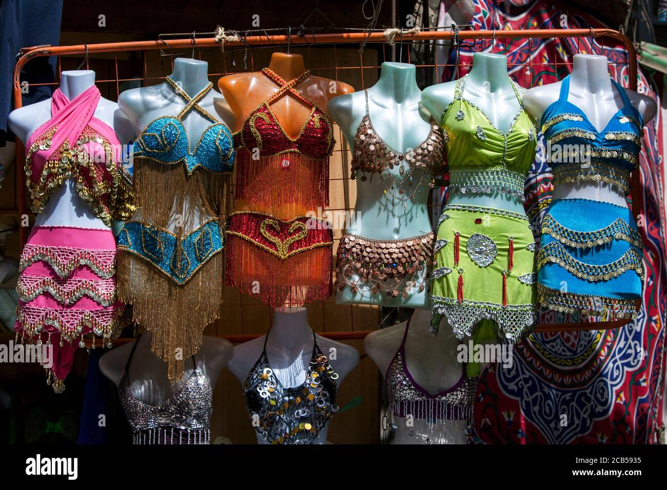 Colourful ladies costumes dressed on mannequins for sale at the Khan el ...