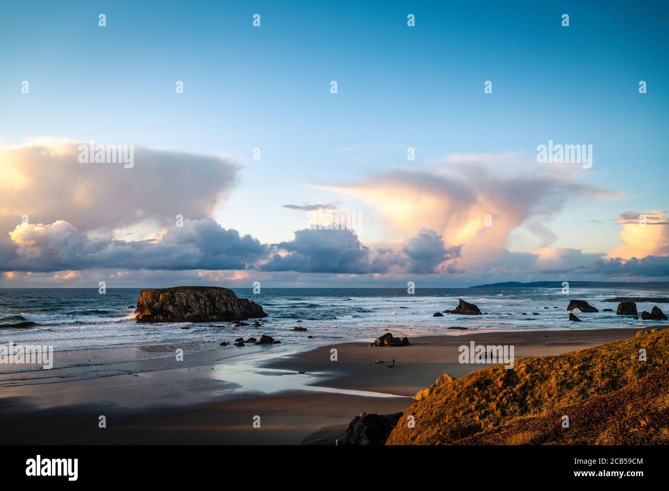 Storm clouds at sunset over rocky beach at Oregon Coast Stock Photo - Alamy