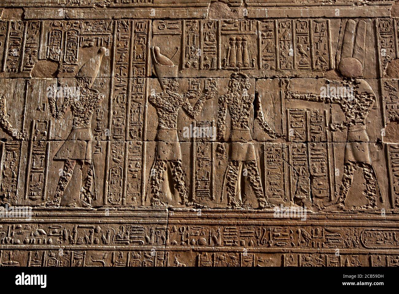A stone wall at the Temple of Horus in Edfu in Egypt showing ...