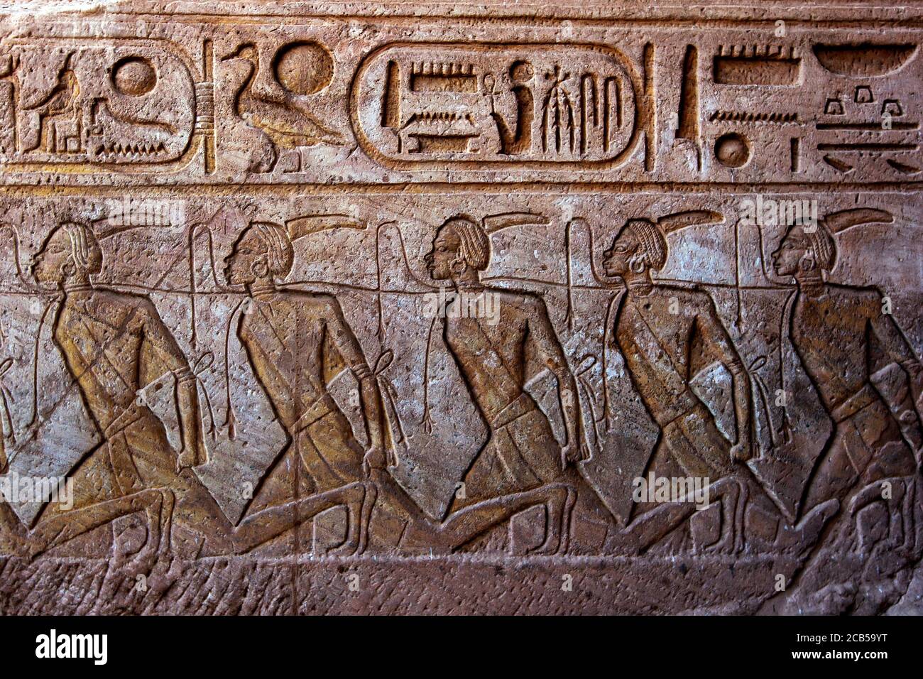A engraving showing roped slaves on the stone wall leading into the ...