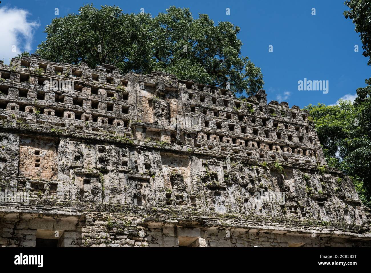 The roof comb of Temple 33 in the ruins of the Mayan city of Yaxchilan ...
