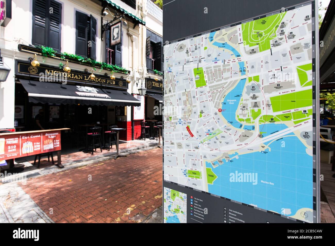 A coloured and detail street directory board located at the entrance of ...