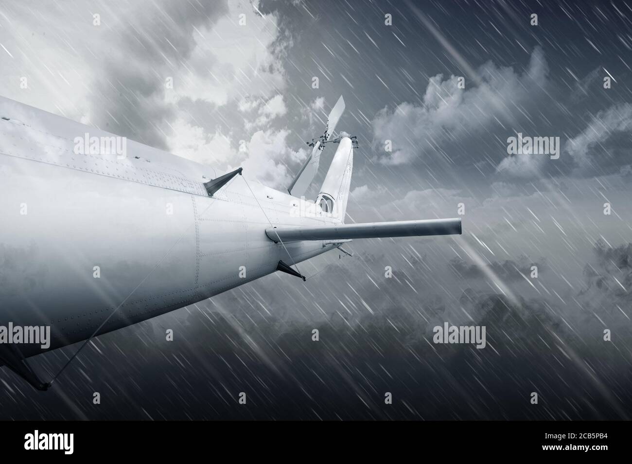 Airplane flying in the air with rainy weather Stock Photo - Alamy