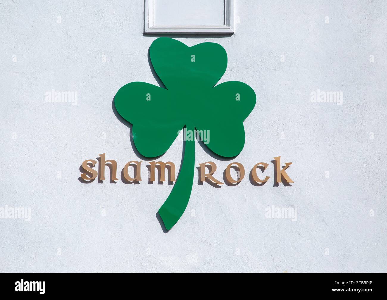 Green Shamrock sign symbol on wall of cafe bar, Ipswich, Suffolk ...