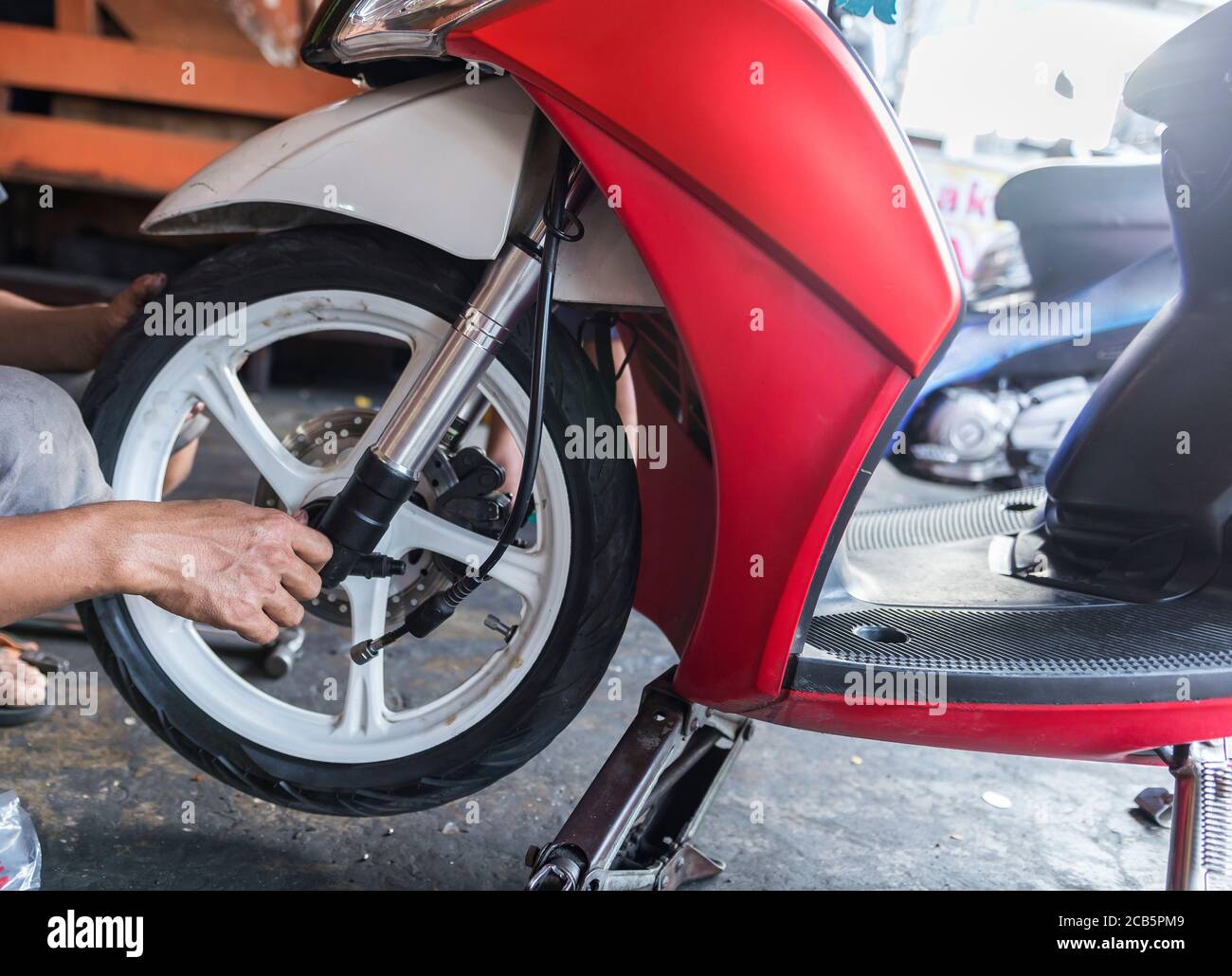 Mechanic working on motorcycle hi-res stock photography and images - Alamy
