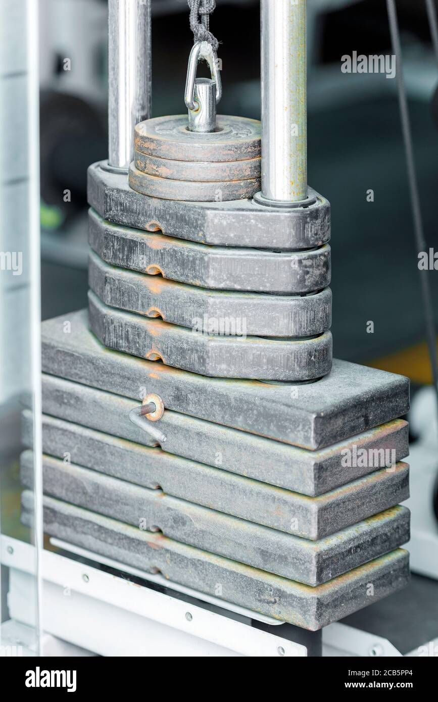 Metallic heavy plates stacked for exercise on the gym Stock Photo - Alamy