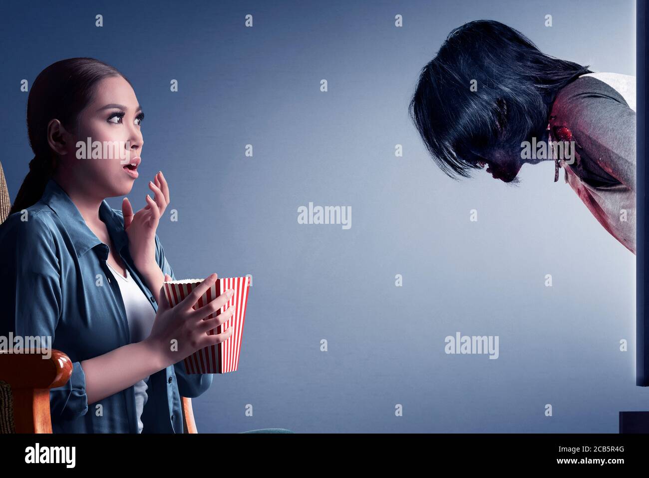 Asian woman scared with zombies coming out from the tv Stock Photo - Alamy