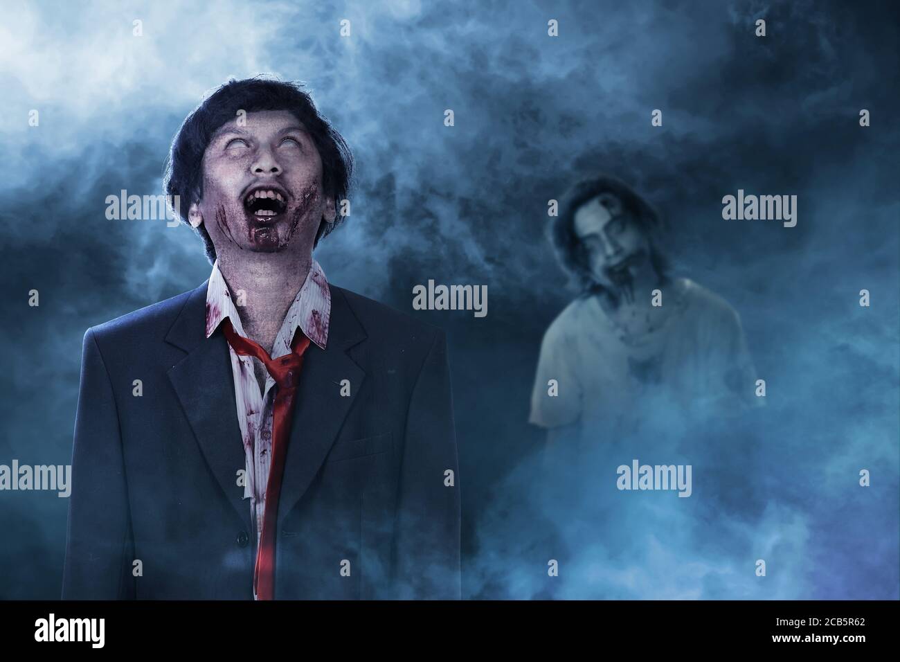 Scary zombies with blood and wound on his body standing with smog ...