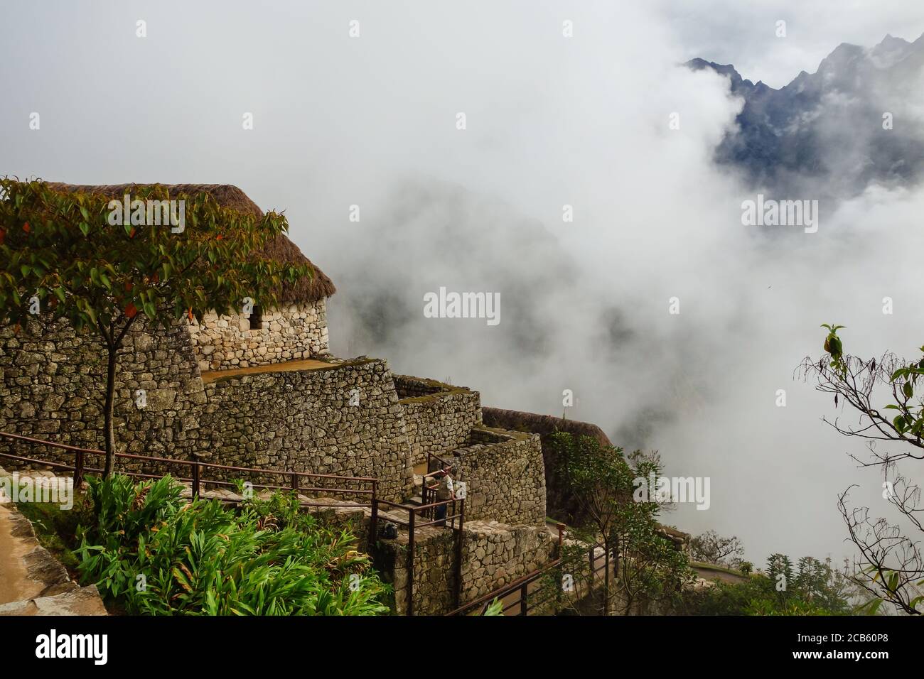 Landscape of Machu Picchu covered in the fog at daytime in Peru Stock ...