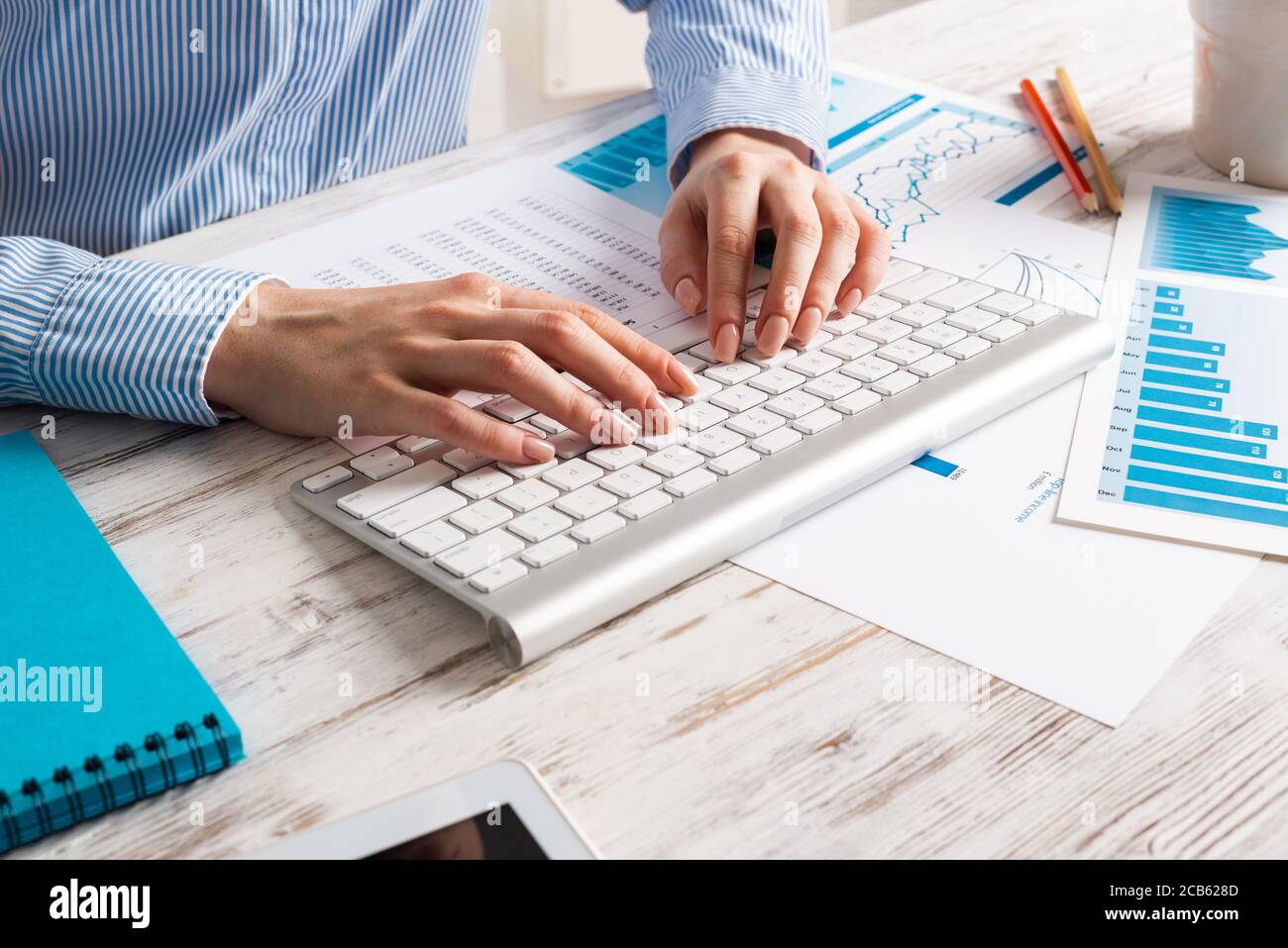 Manager typing on computer keyboard Stock Photo - Alamy