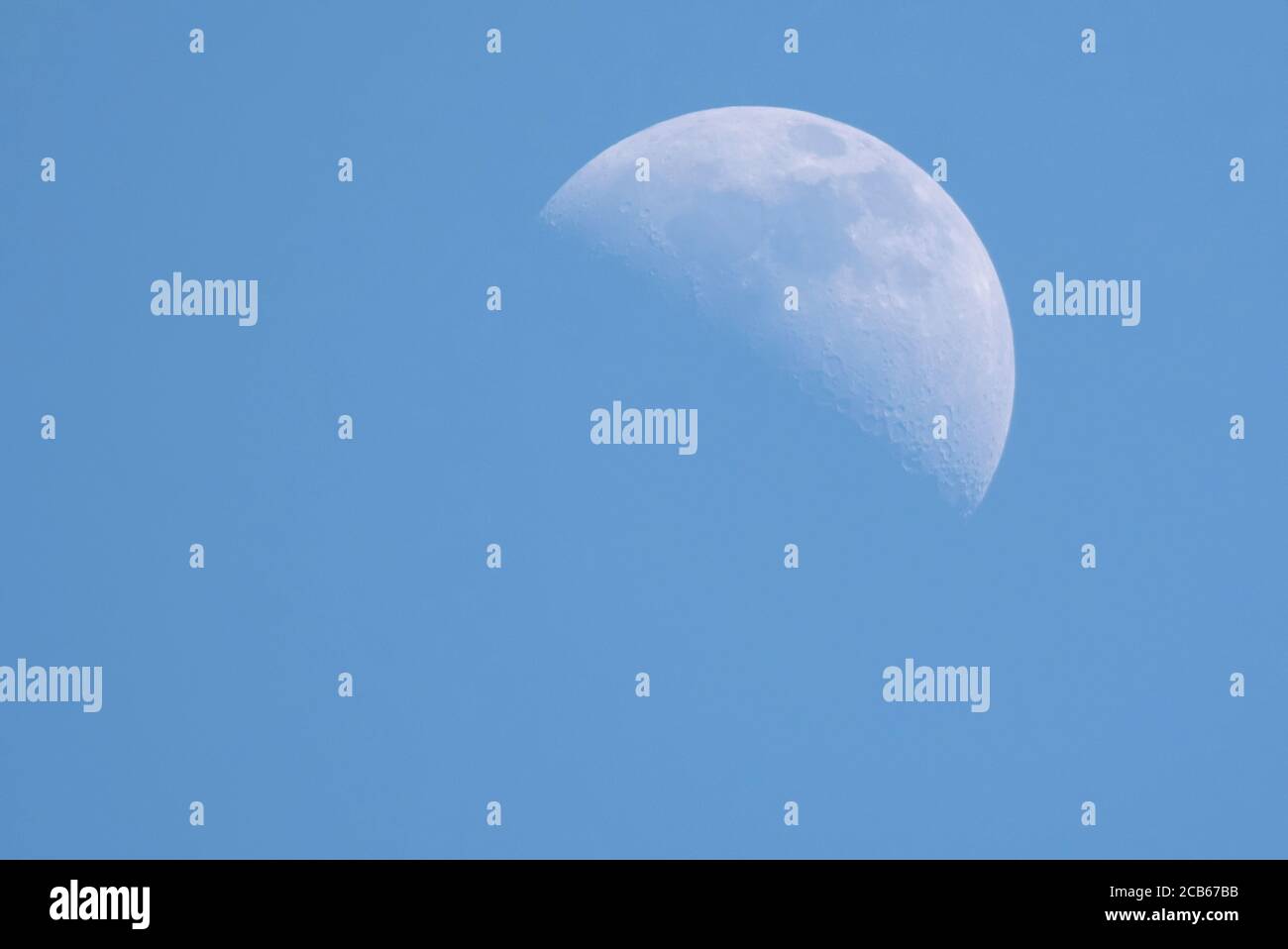 Daytime moon with a blue sky background Stock Photo - Alamy
