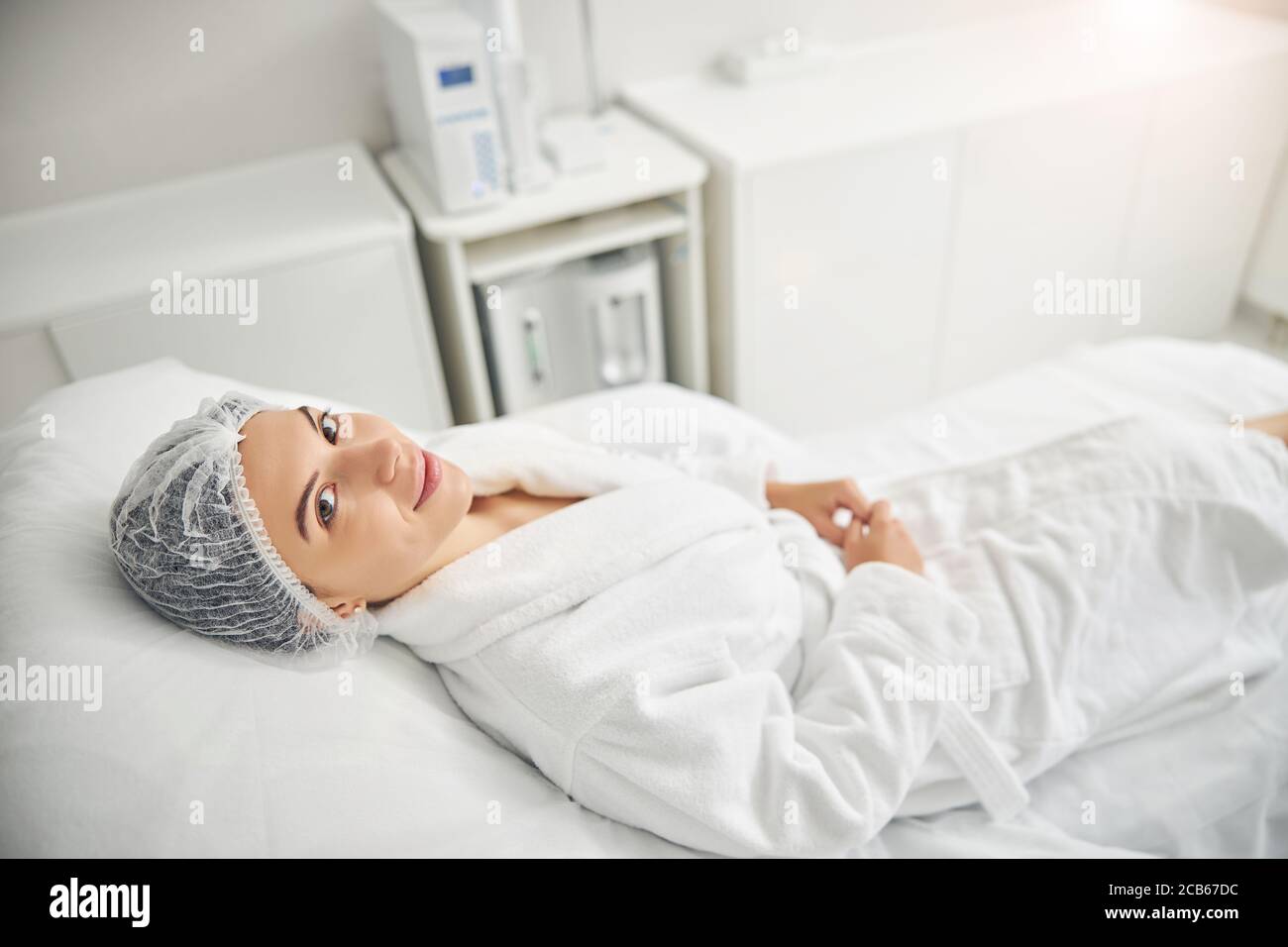 Smiling relaxed beautiful looking up at the camera Stock Photo - Alamy