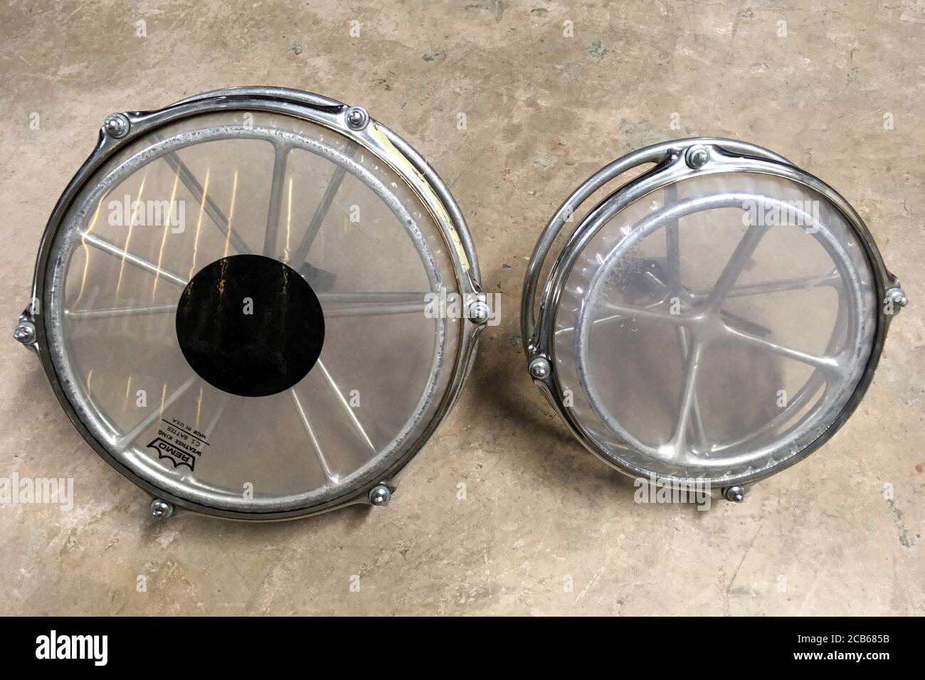 Rototoms, roto toms. Single headed drum which turns on a screw threaded ...