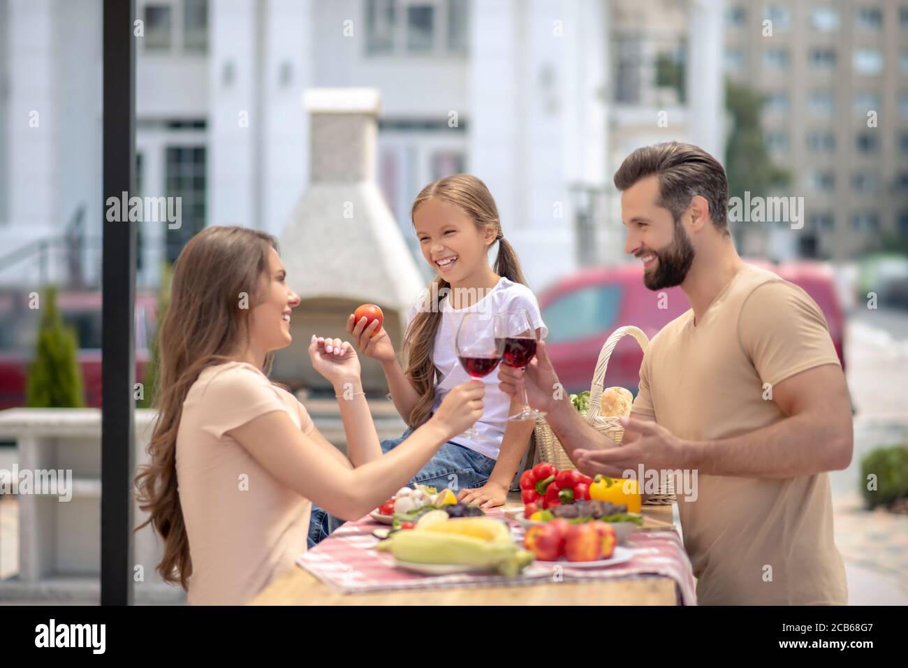 Married couple having dinner with their kid and feeling enjoyed Stock ...