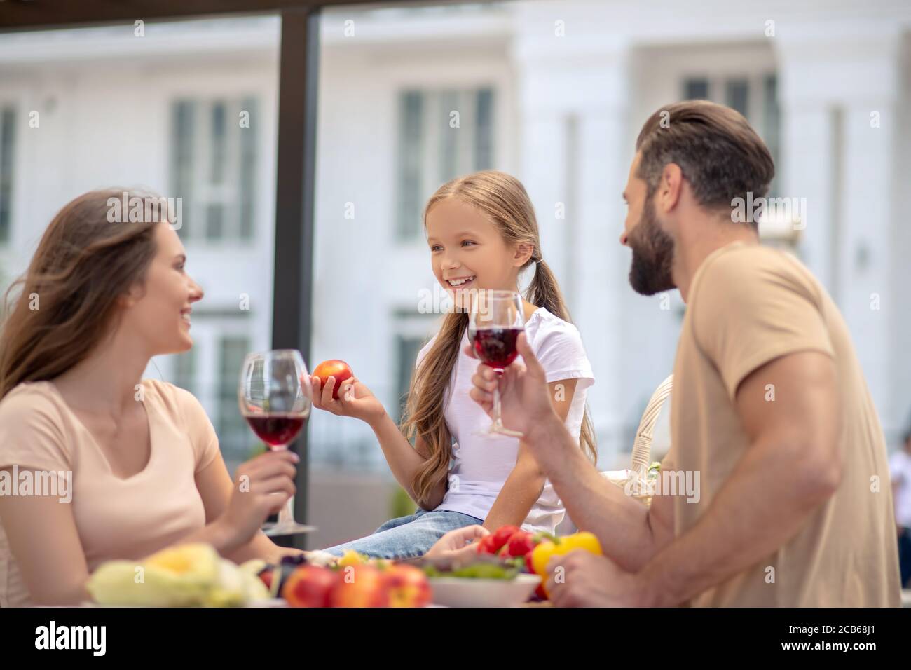 Married couple having dinner with their kid and feeling great Stock ...