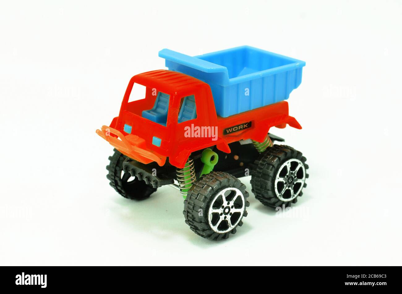 Plastic dump truck toy construction vehicle isolated on white ...