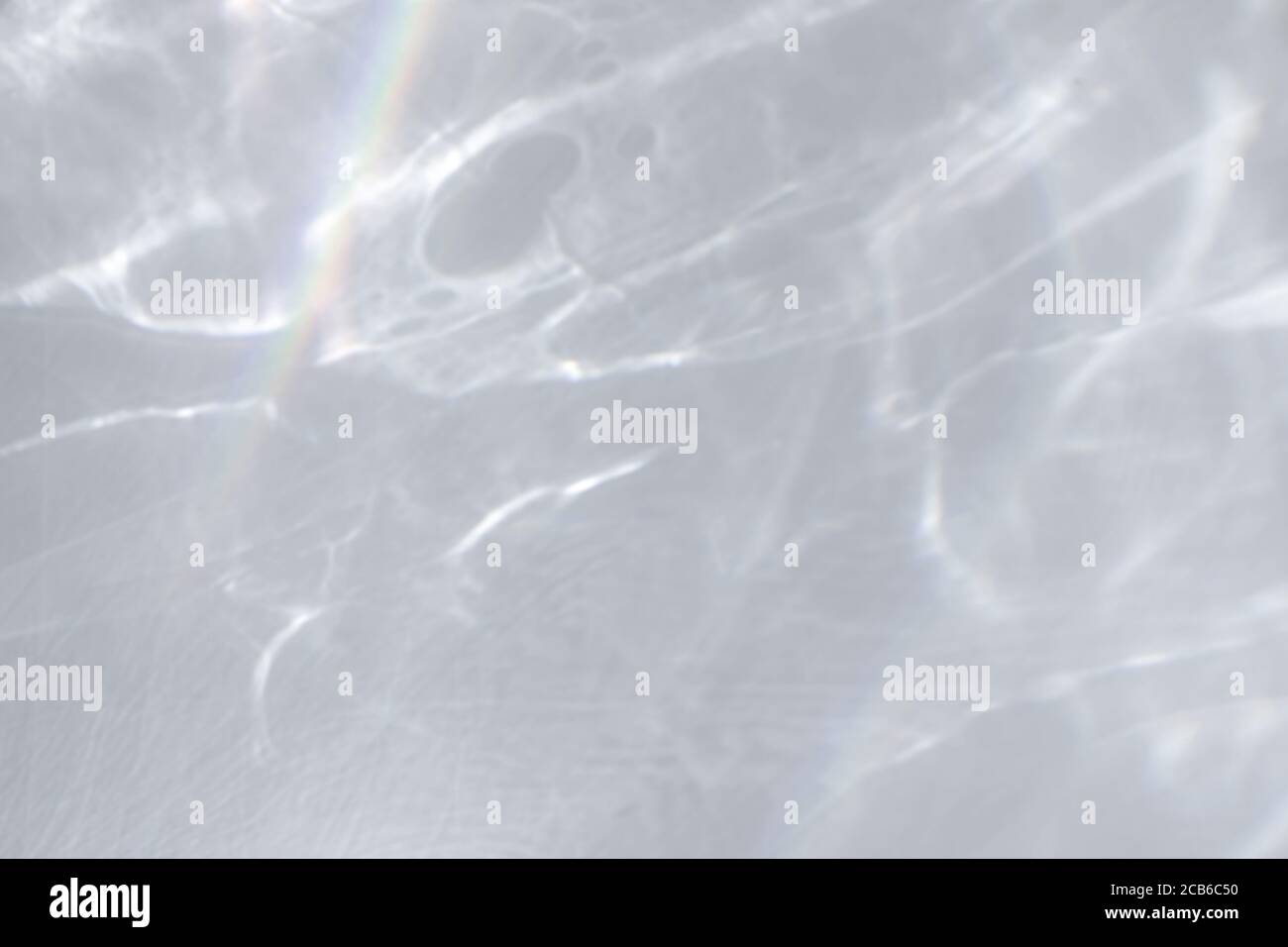 shadow and light caustic effect on a white wall Stock Photo - Alamy