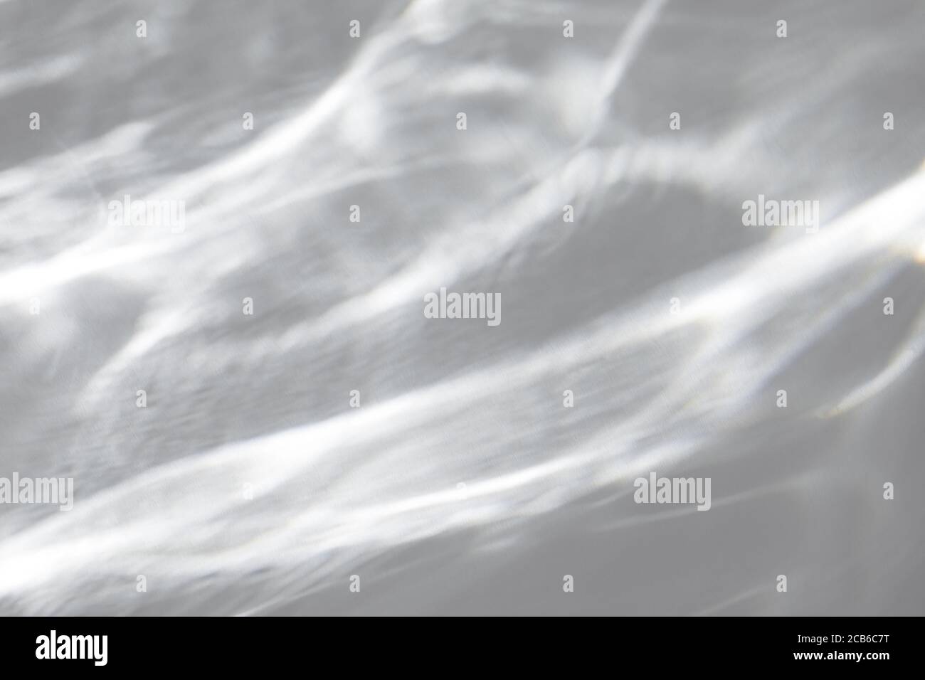 shadow and light caustic effect on a white wall Stock Photo - Alamy