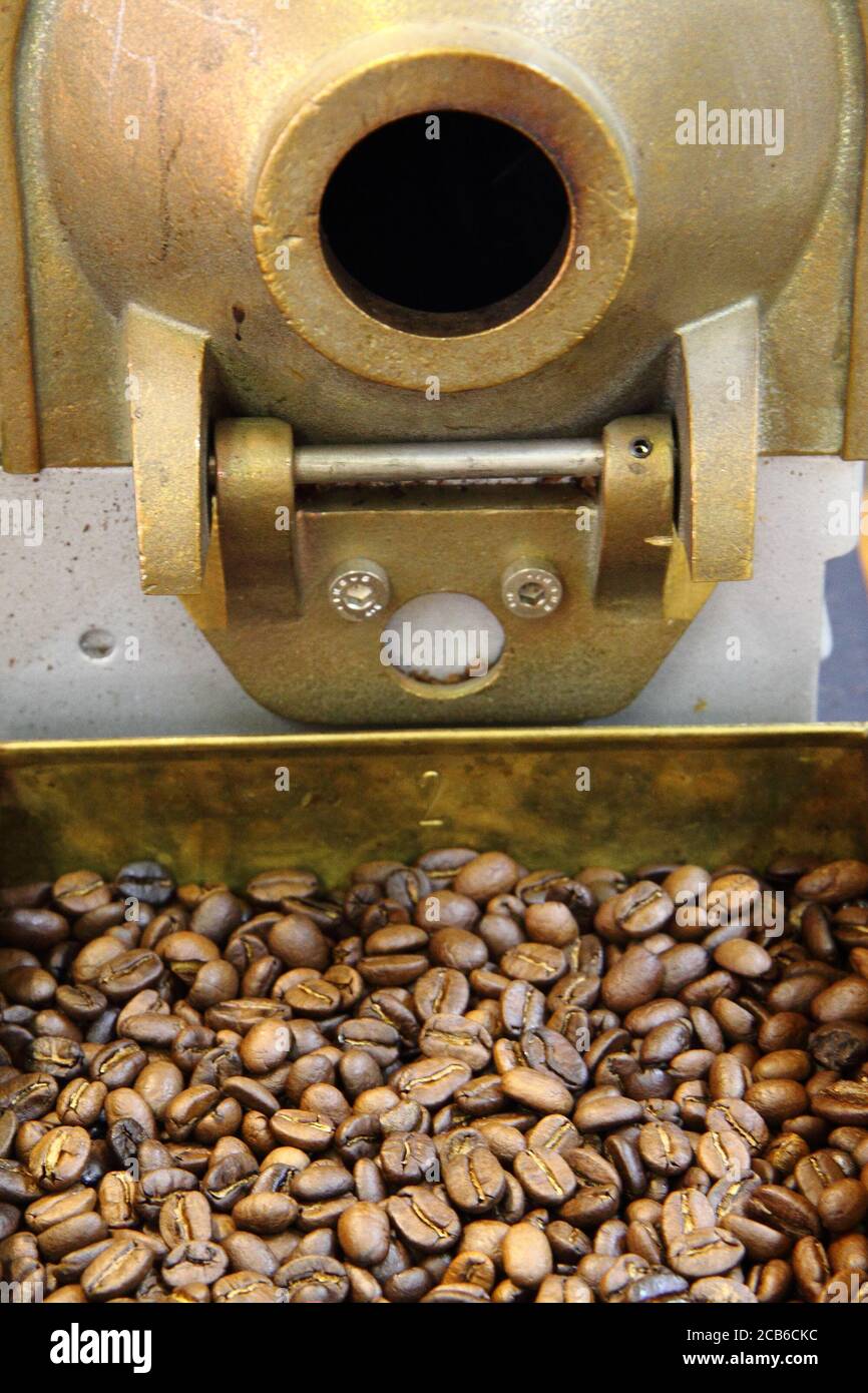 old working coffee beans machine as gourmet background Stock Photo - Alamy